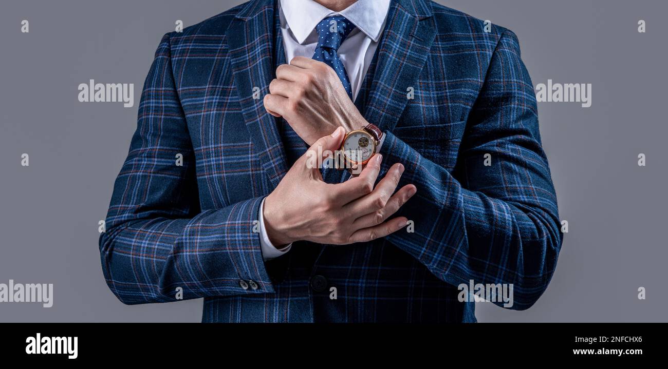 boss wearing wristwatch in studio, cropped view. photo of boss wear ...