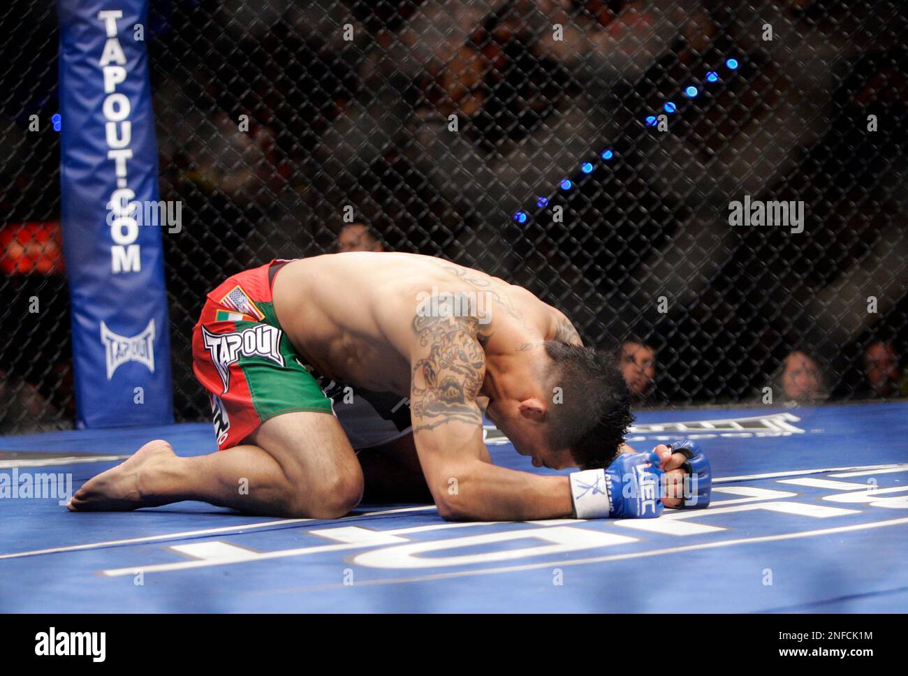 Leonard Garcia celebrates his win over Jens Pulver during World Extreme ...