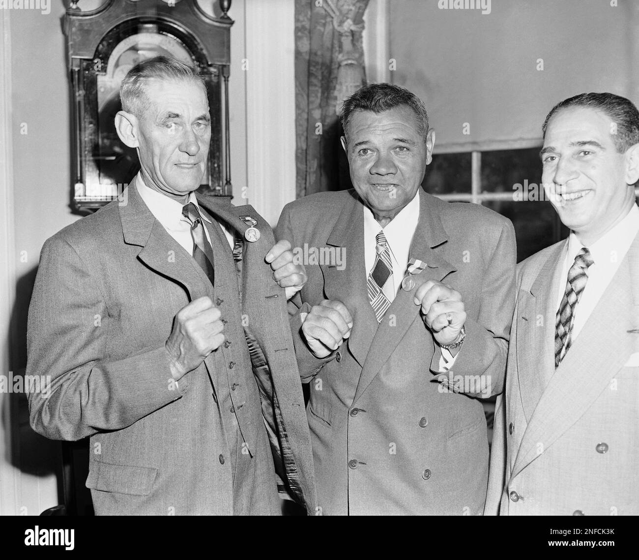 Babe Ruth, right, and John Van Hoose proudly display their medals as ...