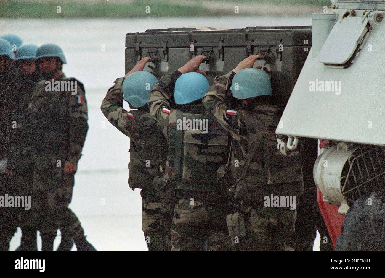 Three French United Nations Peacekeepers bear the casket of their ...