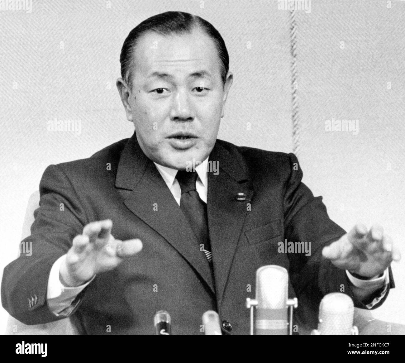Japanese Prime Minister Kakuei Tanaka makes a gesture during a news ...
