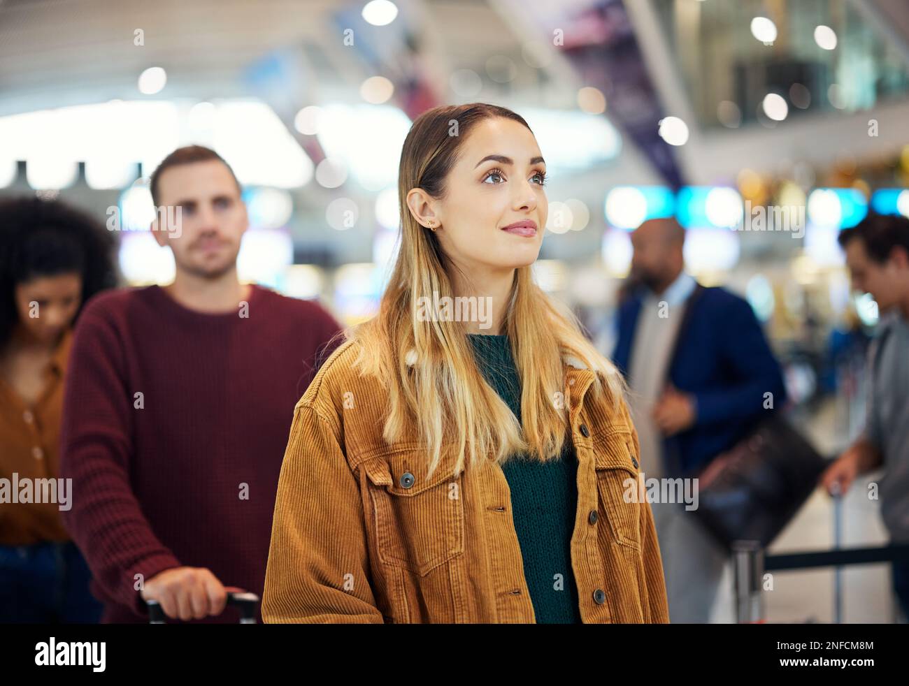 Travel, queue and wait with woman in airport for vacation ...