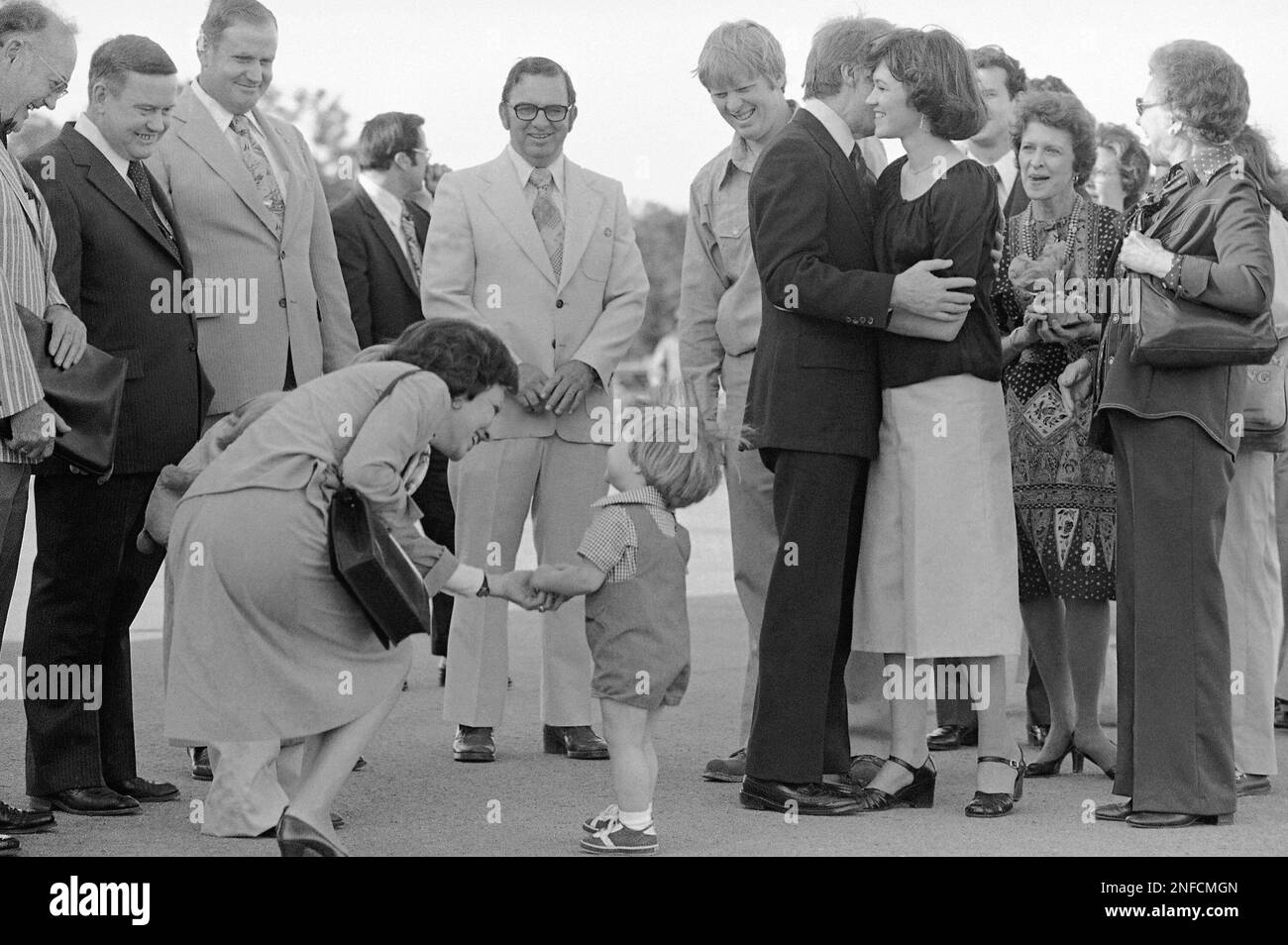 President Jimmy Carter embraces his daughter-in-law Judy Carter as his ...