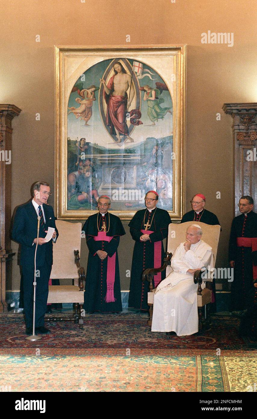 U.S. President George Bush reads his statement as Pope John Paul II ...