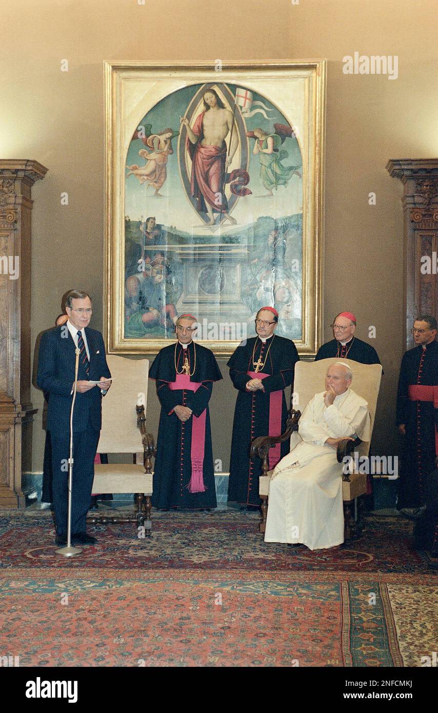 U.S. President George Bush reads his statement as Pope John Paul II ...