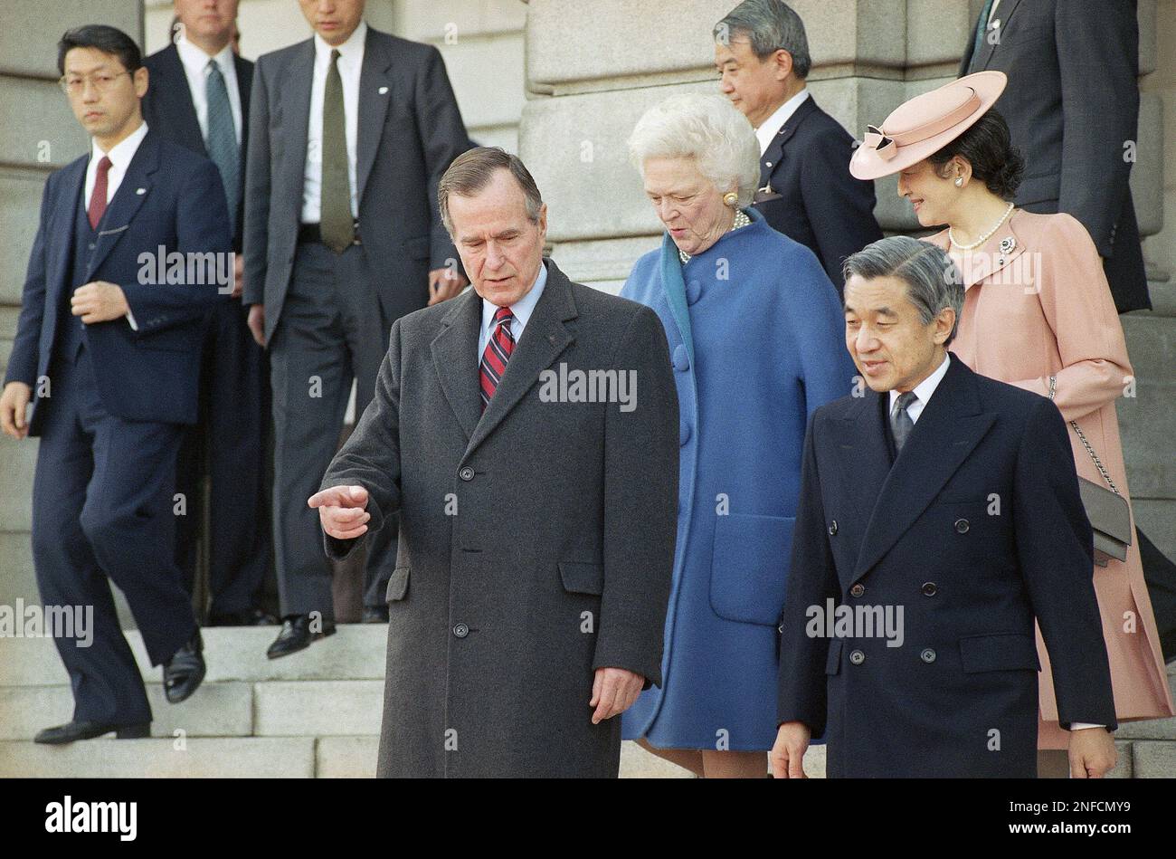 Emperor Akihito, right, walks with U.S. President George Bush as they ...