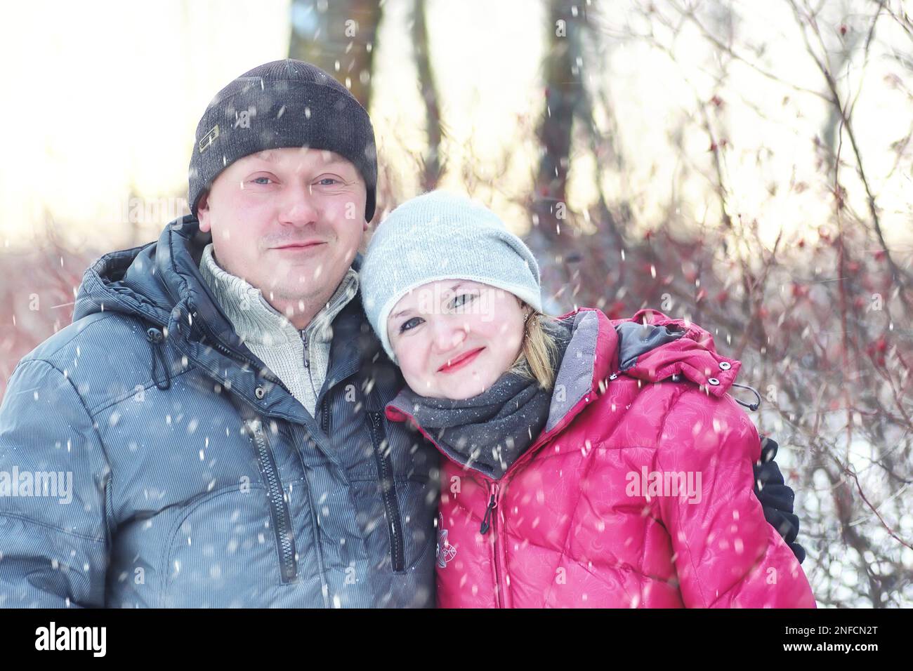 Family with children in the park in winter snow blizzard Stock Photo ...