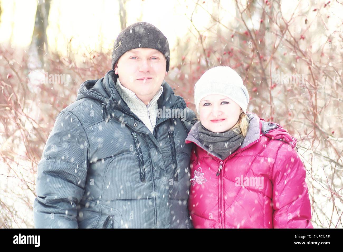 Family with children in the park in winter snow blizzard Stock Photo ...