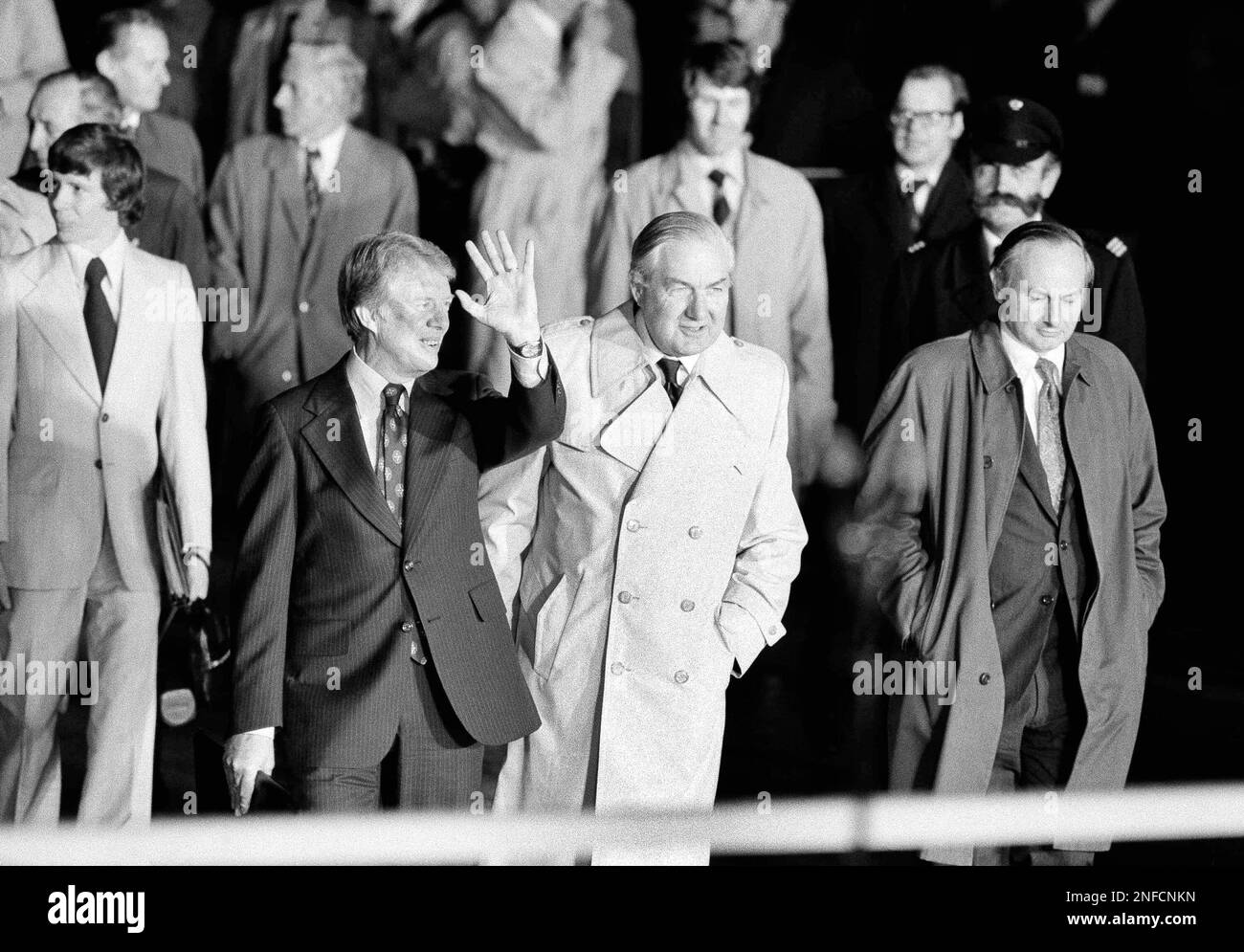 U.S. President Jimmy Carter waves after he arrived to attend the ...