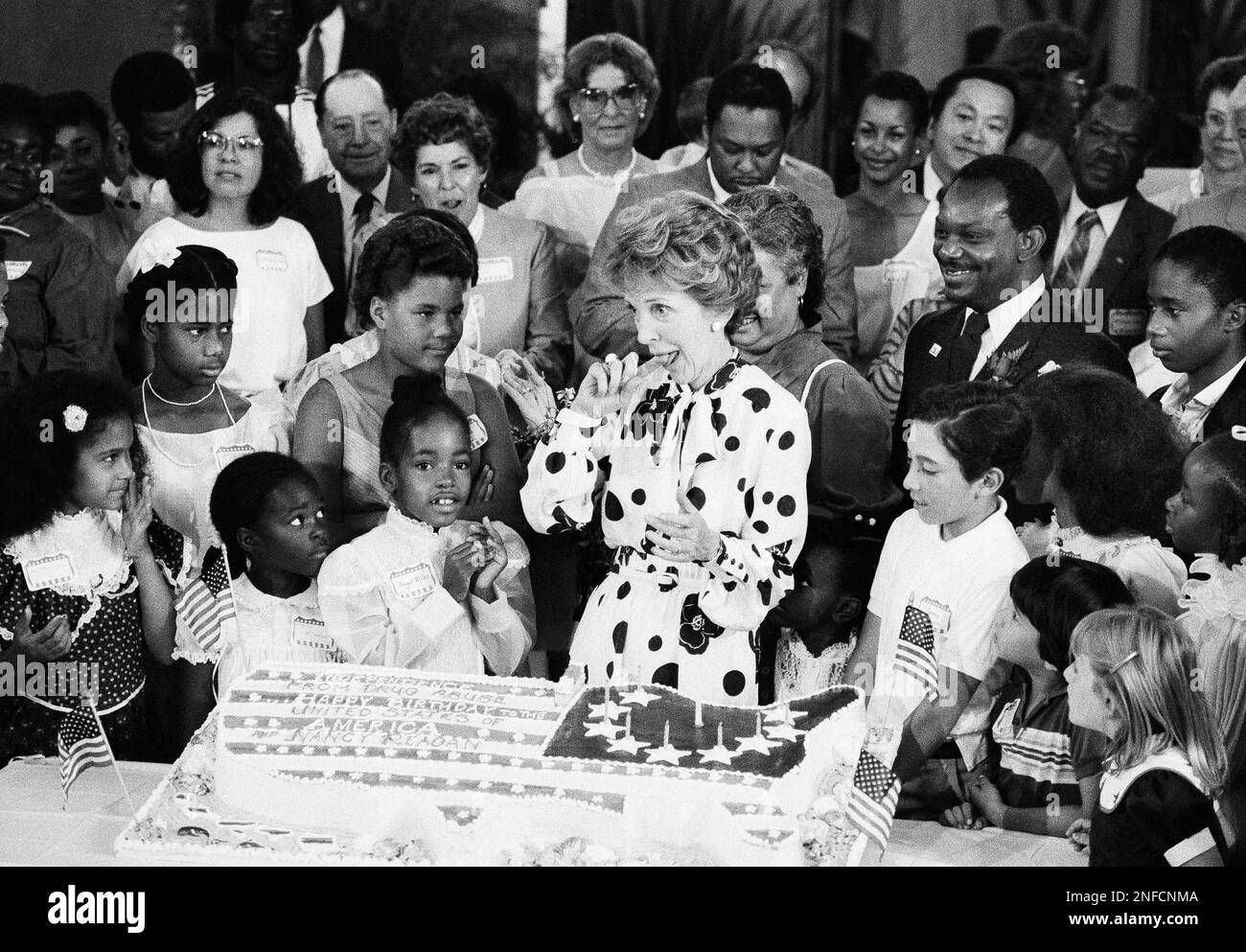 First lady Nancy Reagan casts a look of surprise on her face after ...