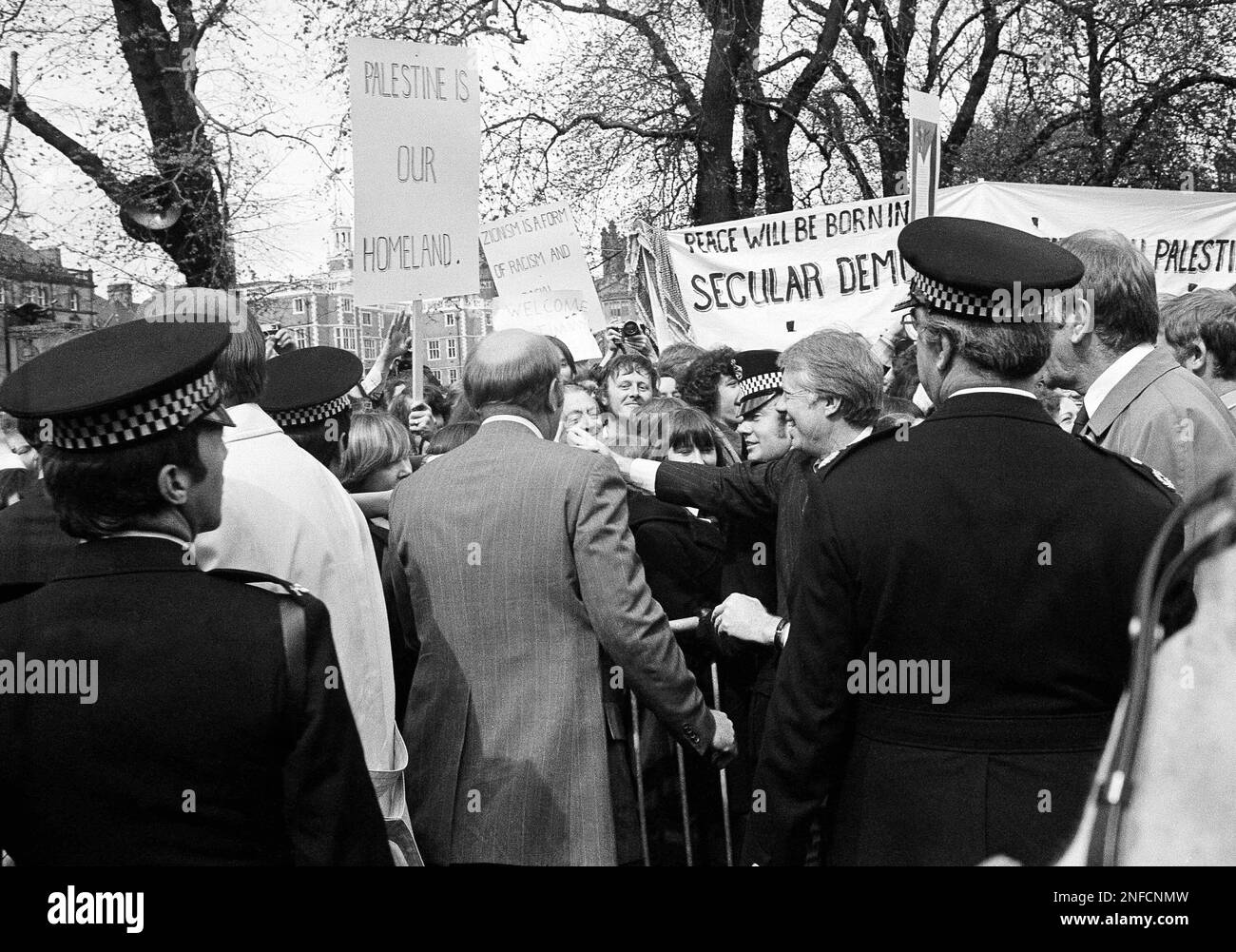 U.S. President Jimmy Carter smiles and reaches out to greet Palestinian ...
