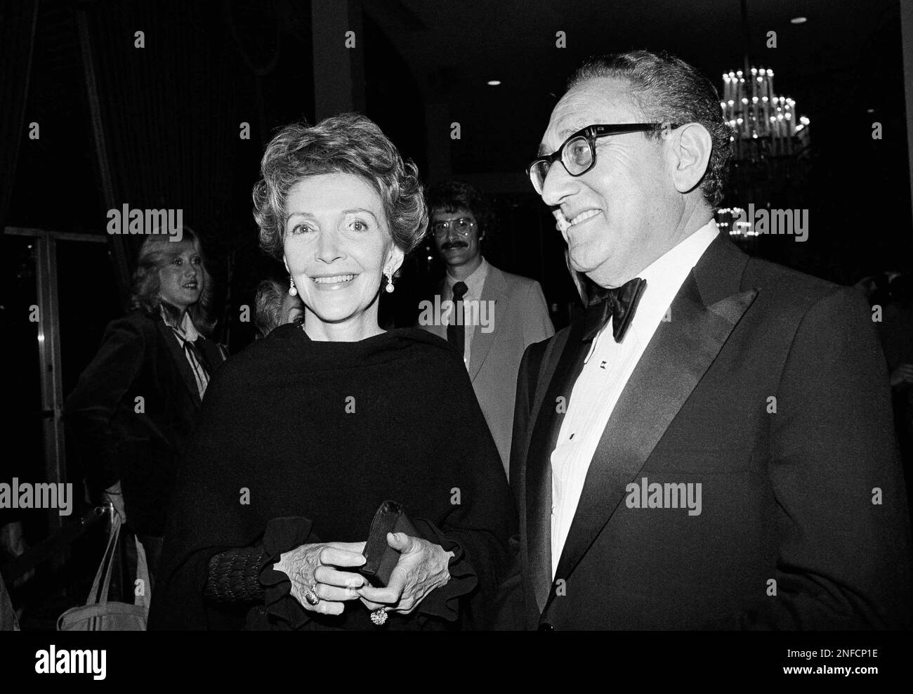 Mrs. Nancy Regan with Henry Kissinger at California party shown in ...