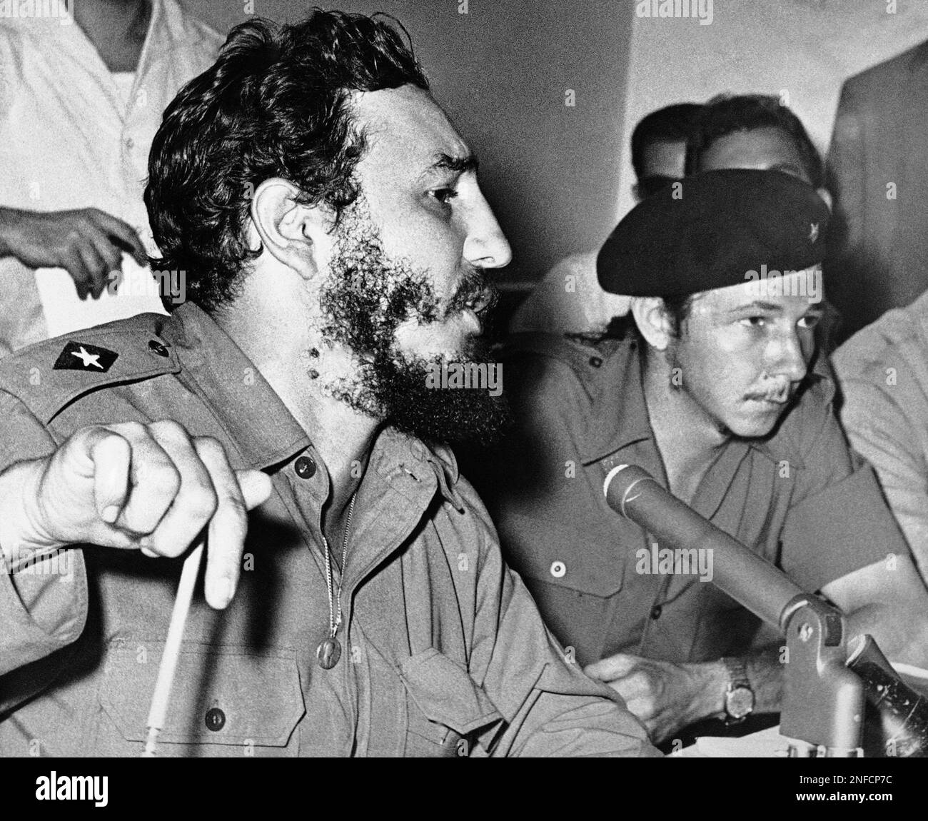 The Cuban government of Premier Fidel Castro, left, seen at his first ...