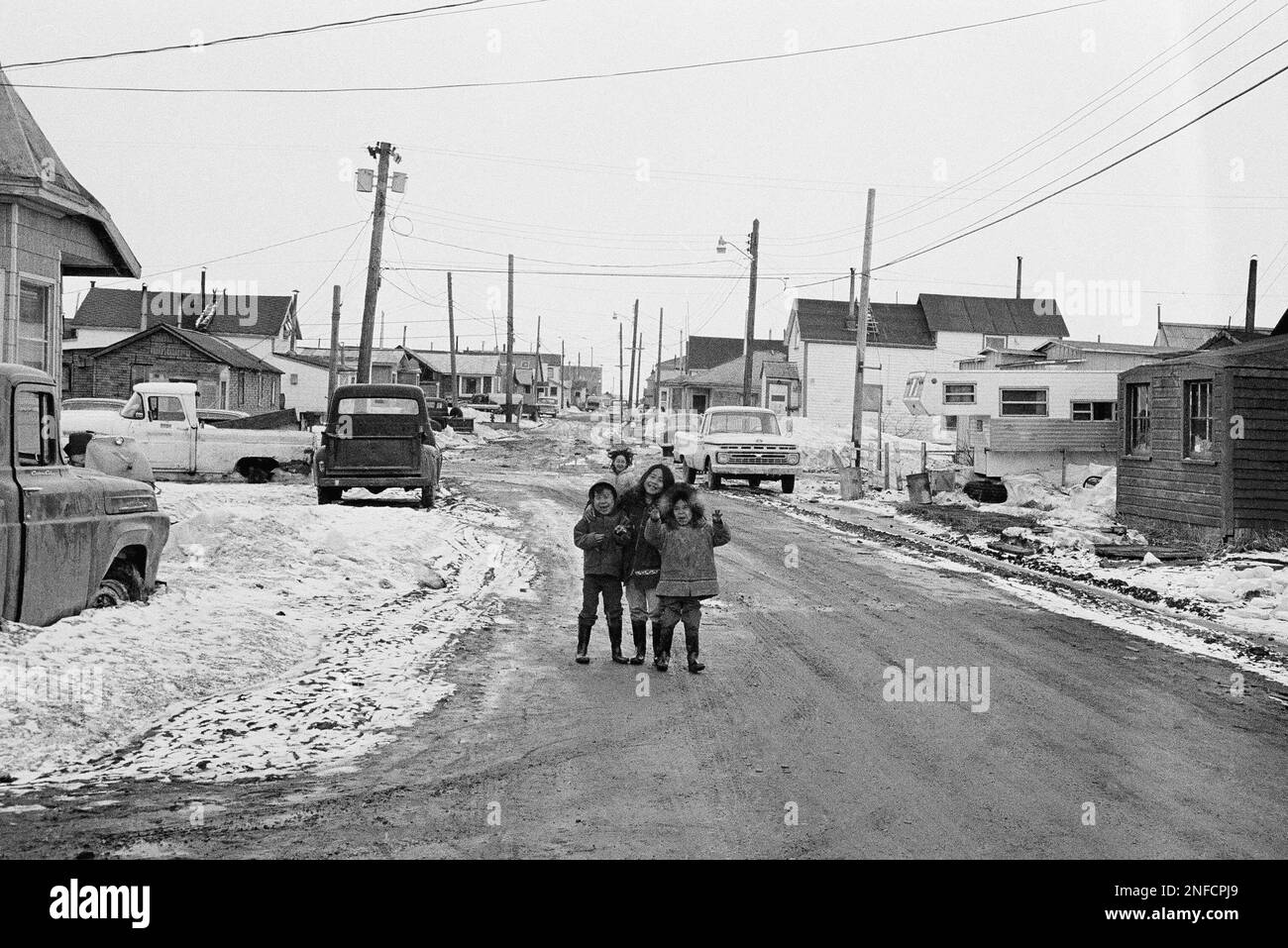 Inuit children, bundled up against the Arctic cold, are pictured on one ...
