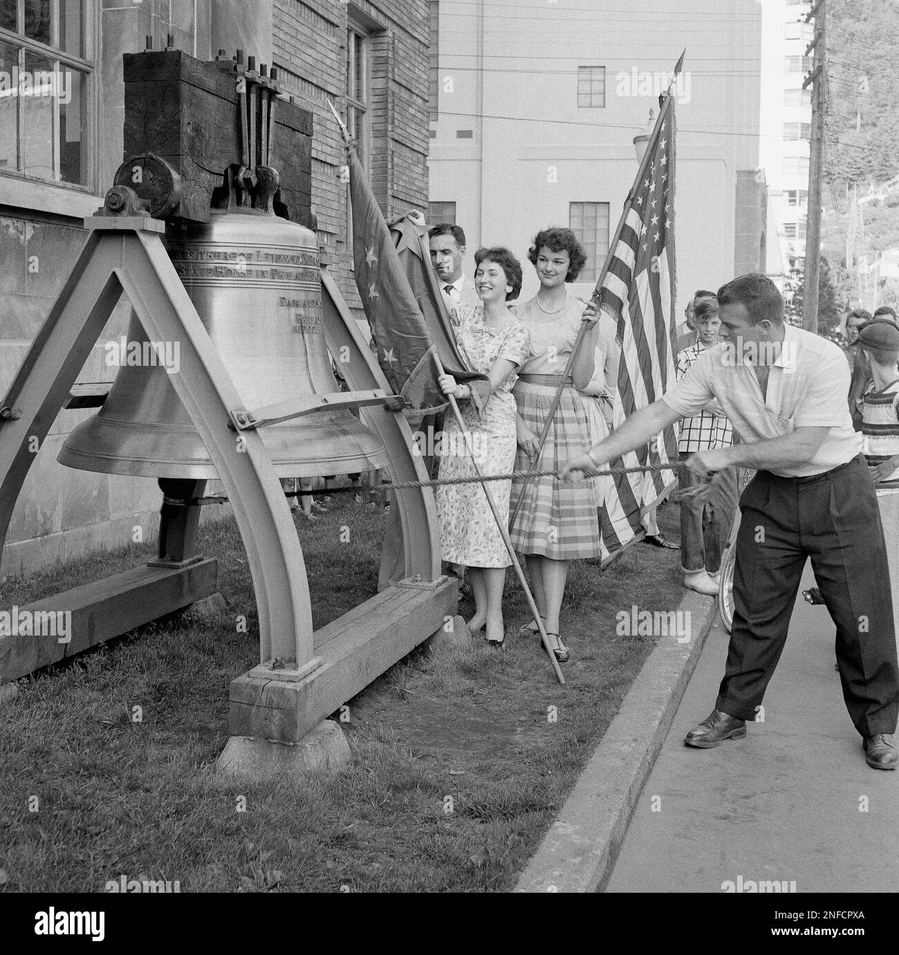 Romer Derr of Juneau rings a replica of the Liberty Bell outside the ...