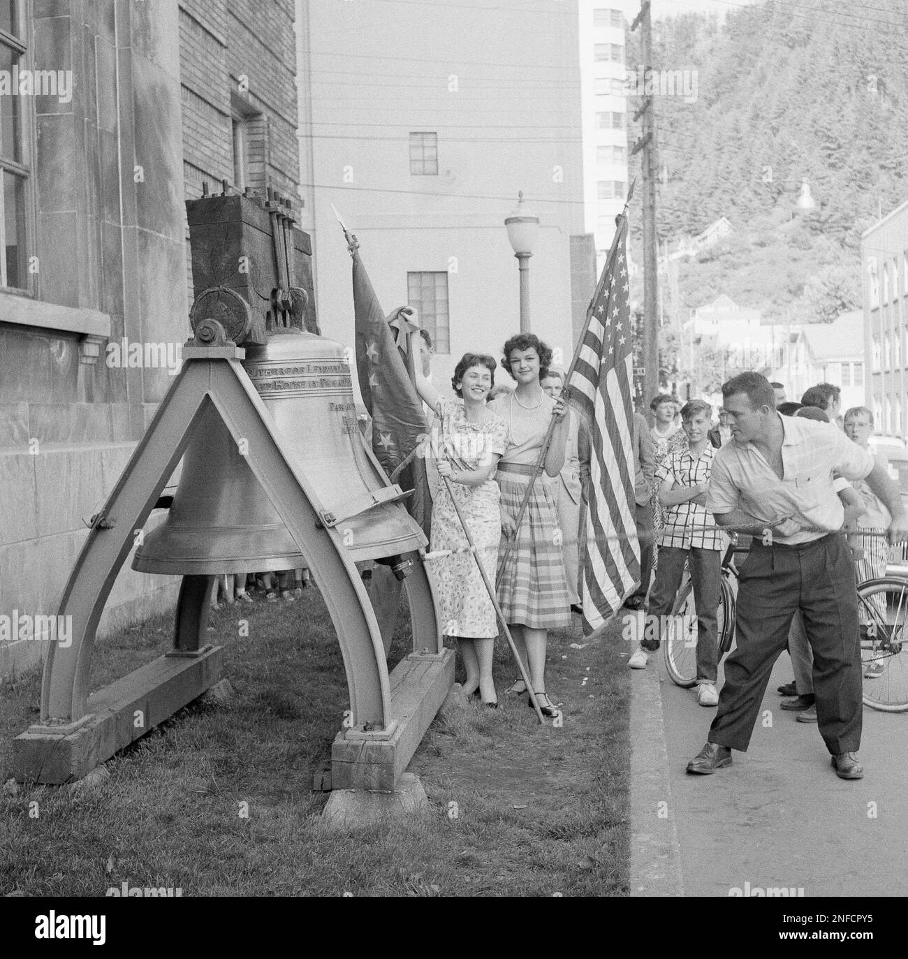 Romer Derr of Juneau rings a replica of the Liberty Bell outside the ...