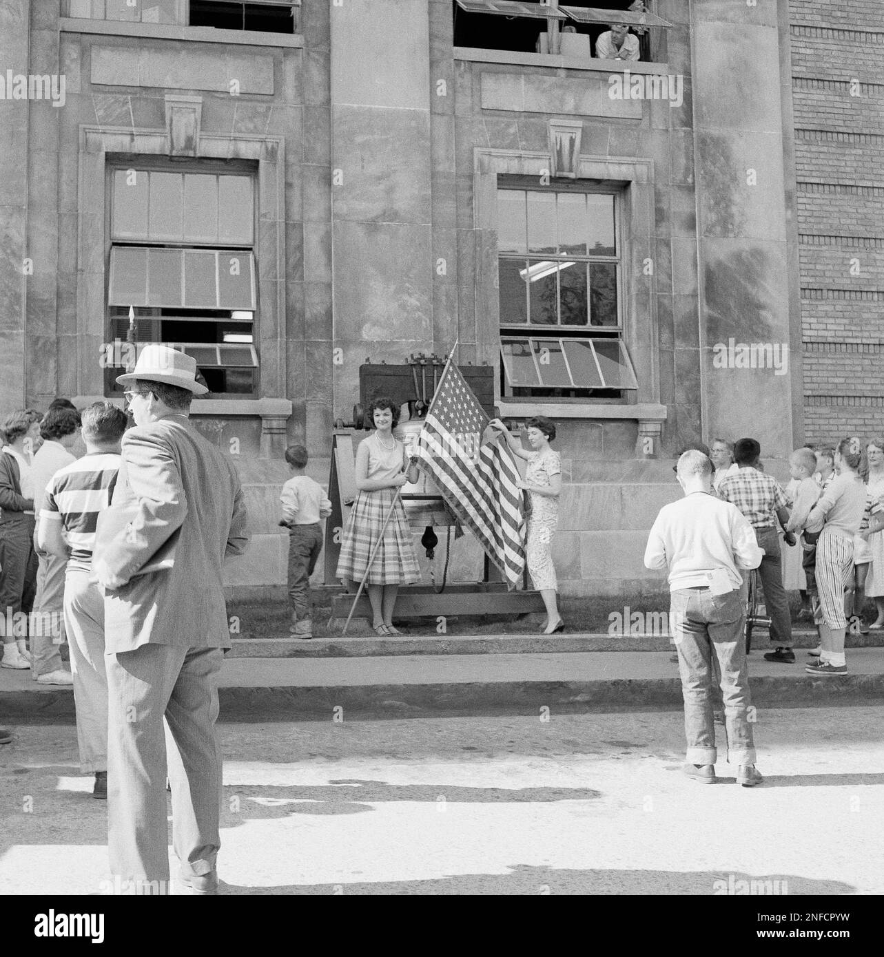 A crowd gathers outside the Territorial Building in Juneau, Alaska ...