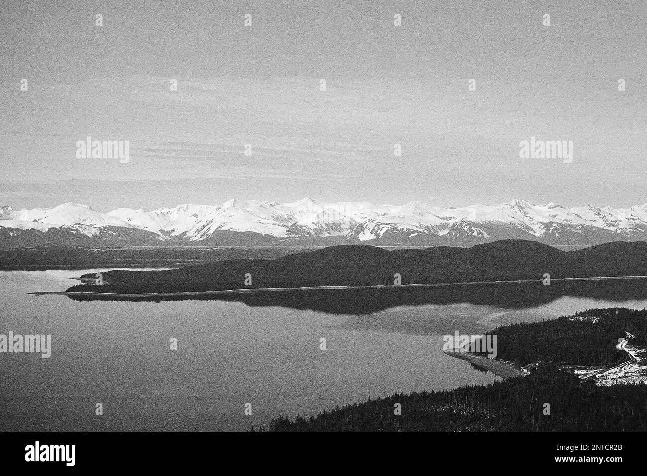 This is an aerial view of the Juneau ice fields (background) of Juneau ...