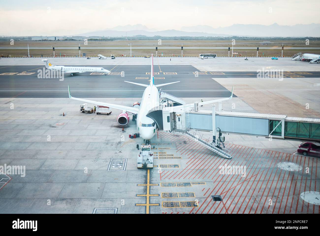 Travel, departure and airplane on land at the airport for fuel, cargo ...