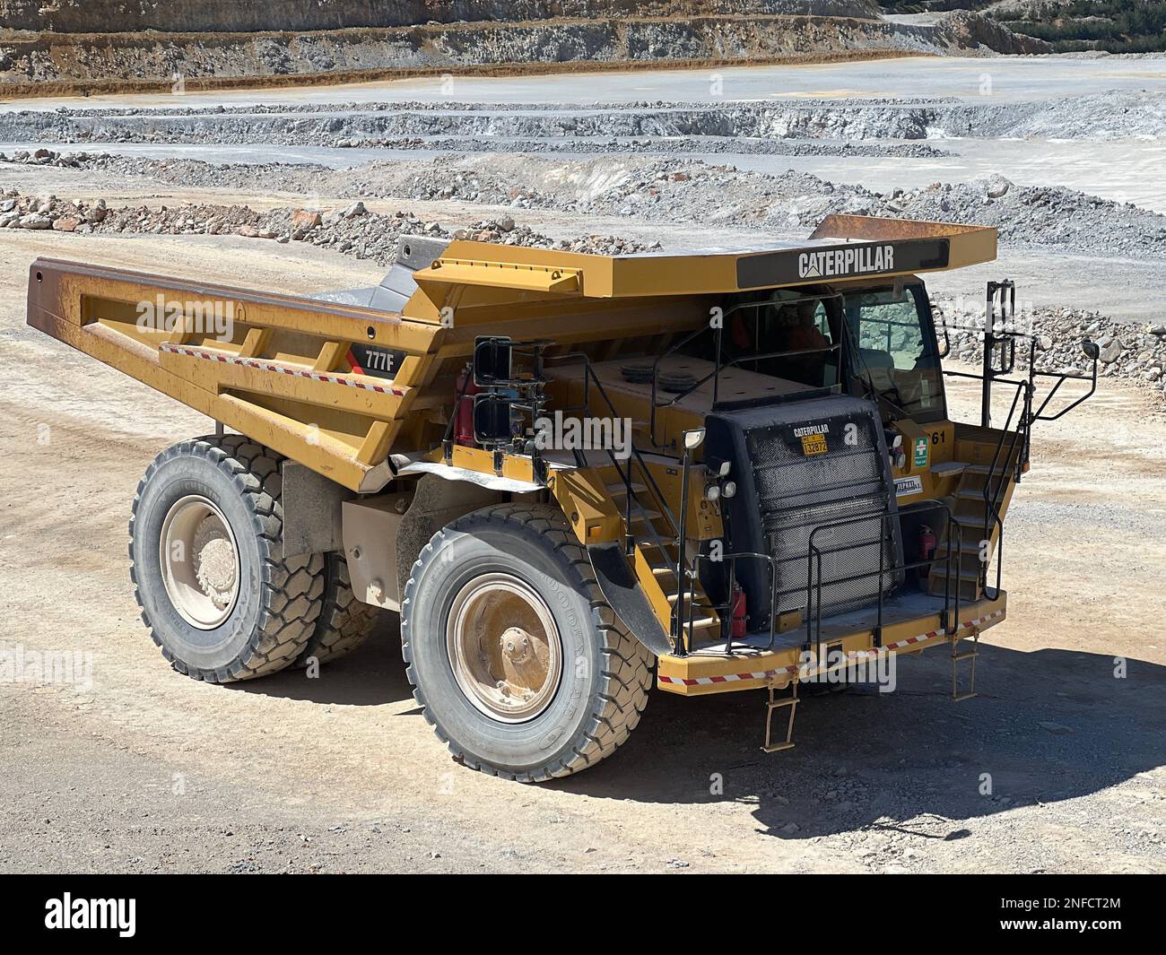 Large quarry dump truck full of stones. Transporting the ore into the ...