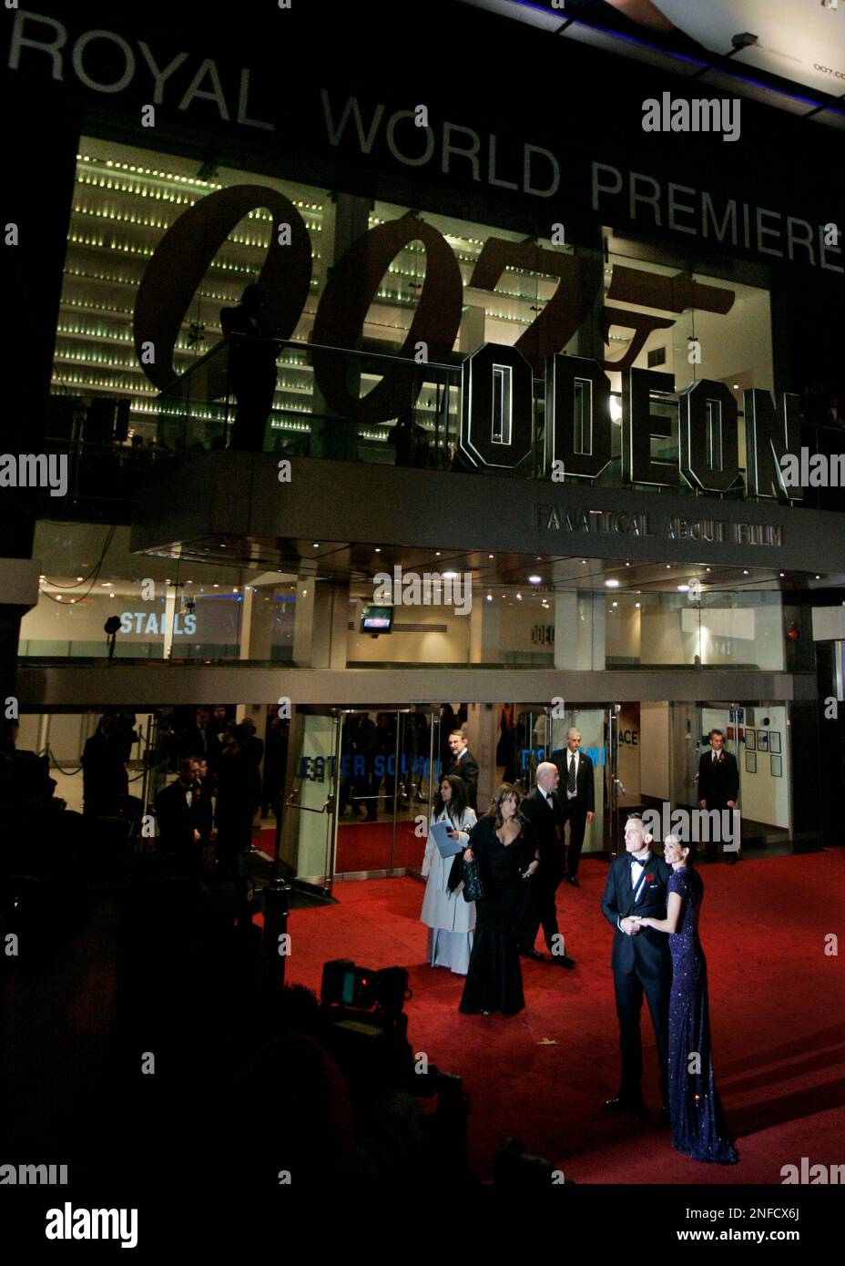 Actor Daniel Graig, bottom left, accompanied by Satsuki Mitchell, right ...