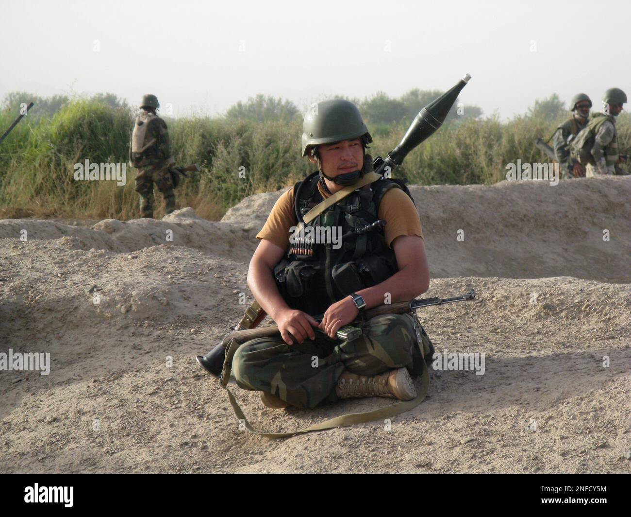 An Afghan Army soldier takes a break during an operation in Zhari ...