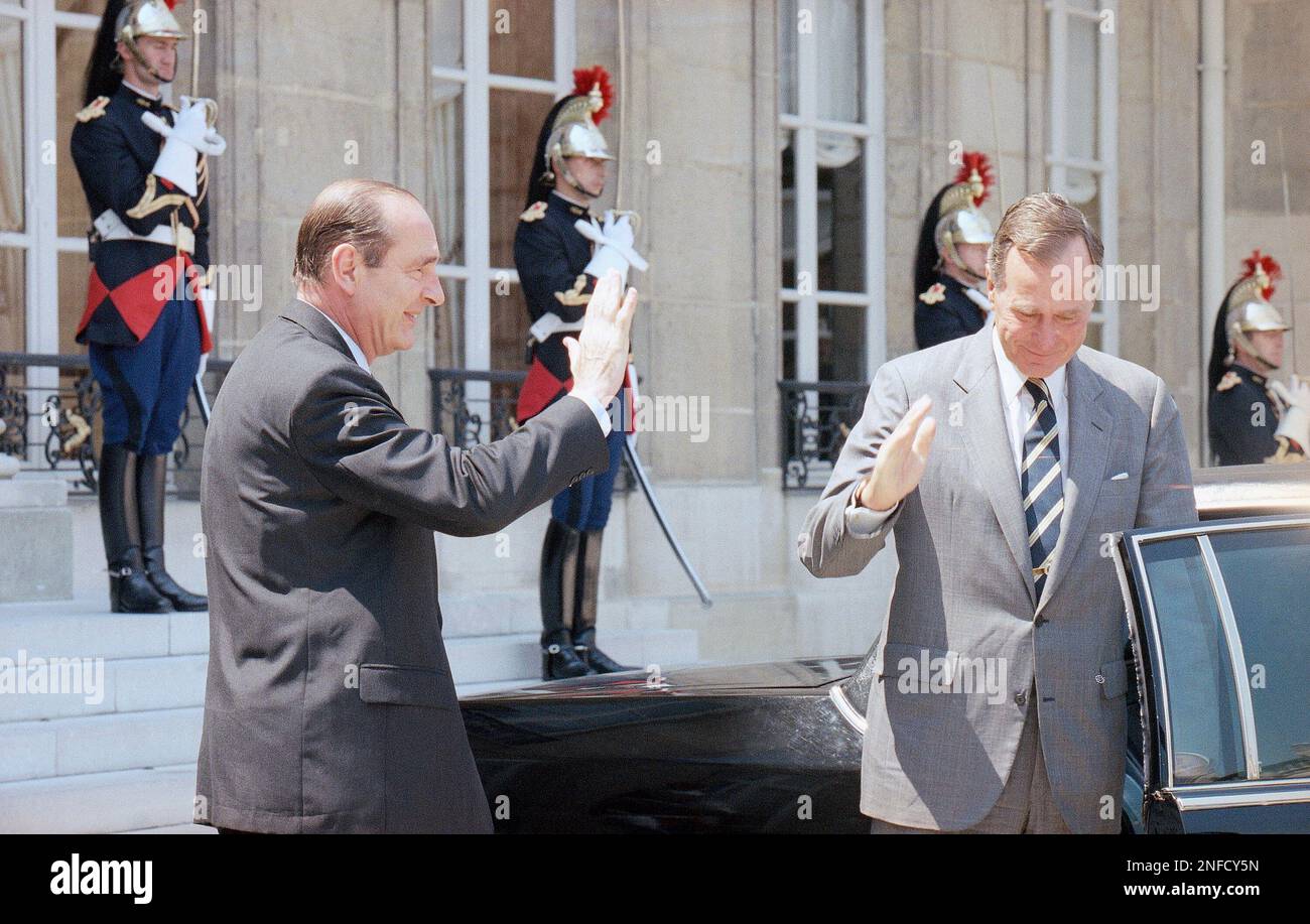 President George Bush salutes as he takes leave of French President ...