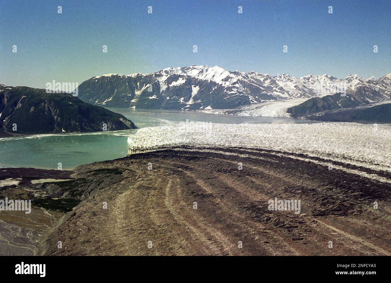 Alaska's Hubbard Glacier, foreground, and nudges forward toward Gilbert ...