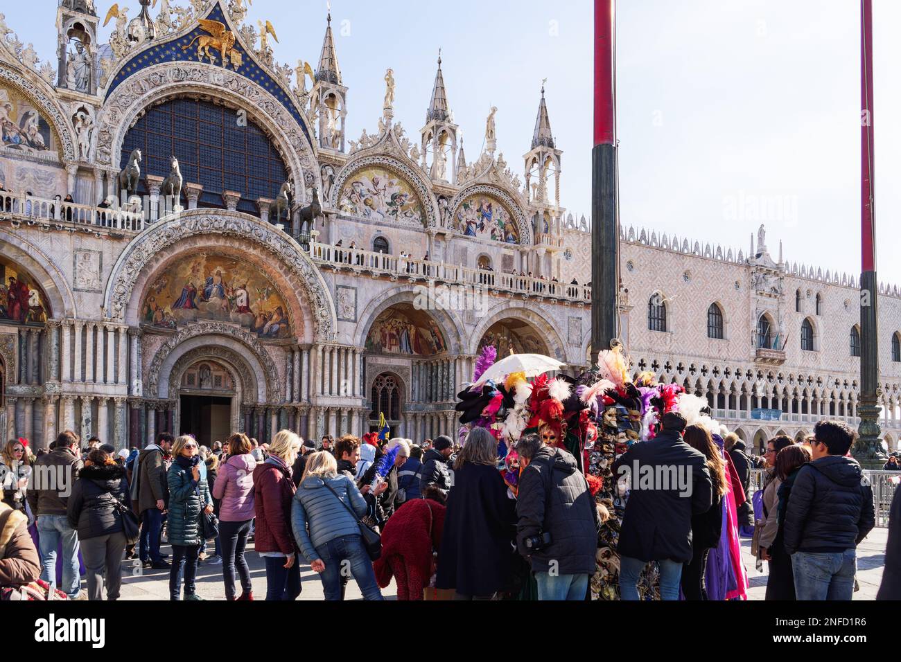 Venice, Italy Saint Mark square with crowd during carnival. Basilica di San Marco facade with ...