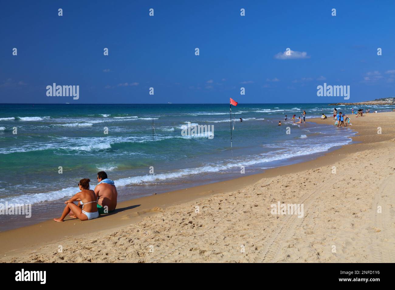 HAIFA, ISRAEL - NOVEMBER 1, 2022: People visit sandy Dado Beach in ...