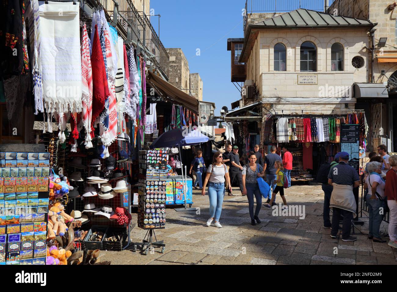 JERUSALEM, ISRAEL - OCTOBER 28, 2022: Tourists visit one of many souks ...