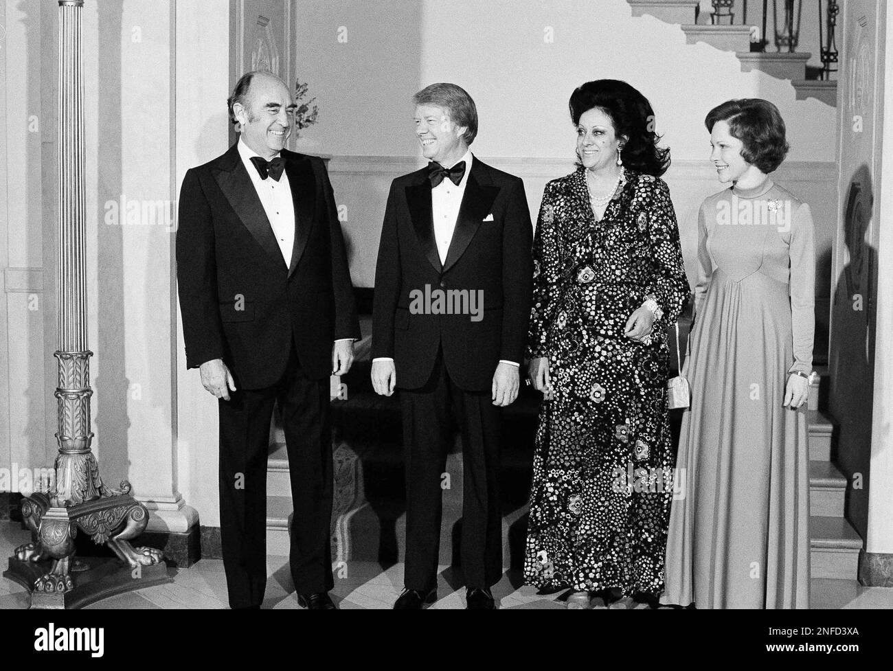 President Jimmy Carter and first lady Rosalynn Carter stand with ...