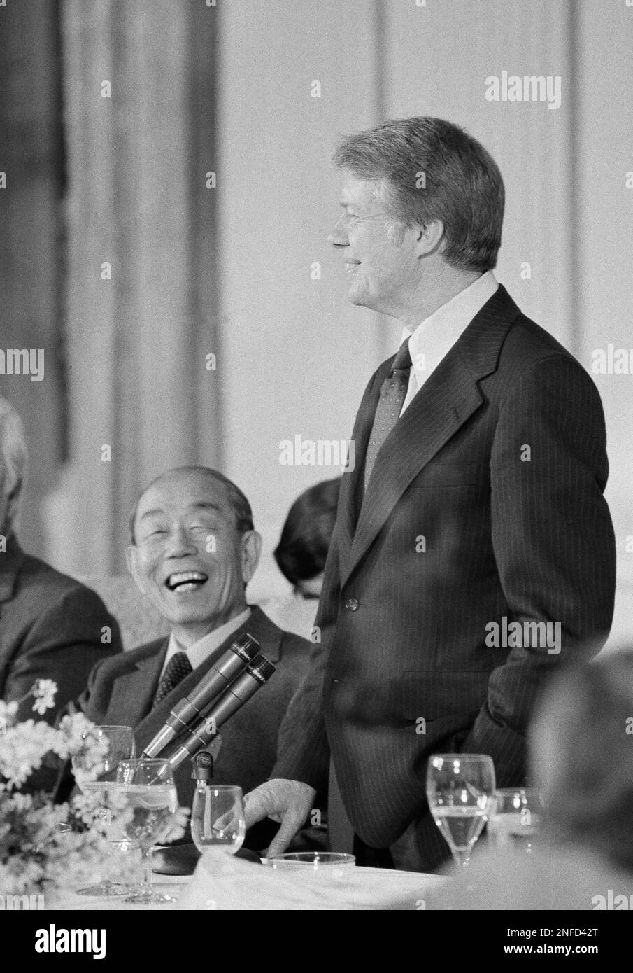 Japanese Prime Minister Takeo Fukuda, left, laughs at a remark from ...
