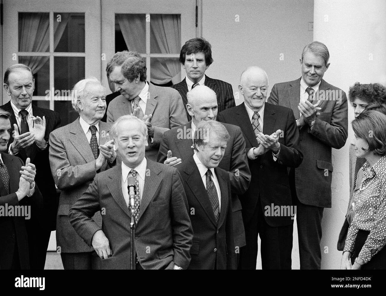 Paul Warnke, at microphone, receives applause after he was sworn in as ...