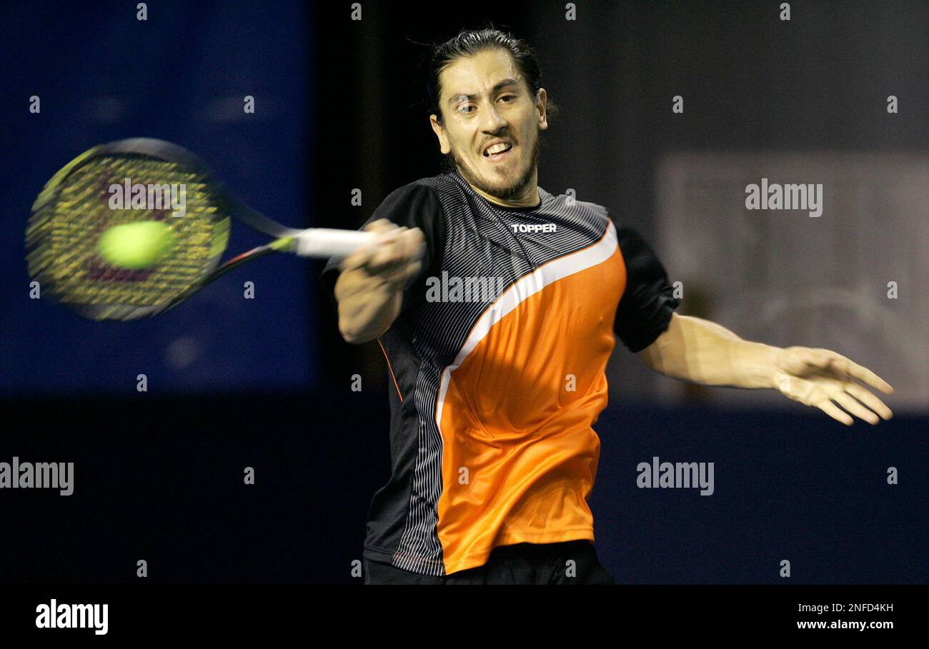 Guillermo Canas of Argentina plays a return to Florent Serra of France ...