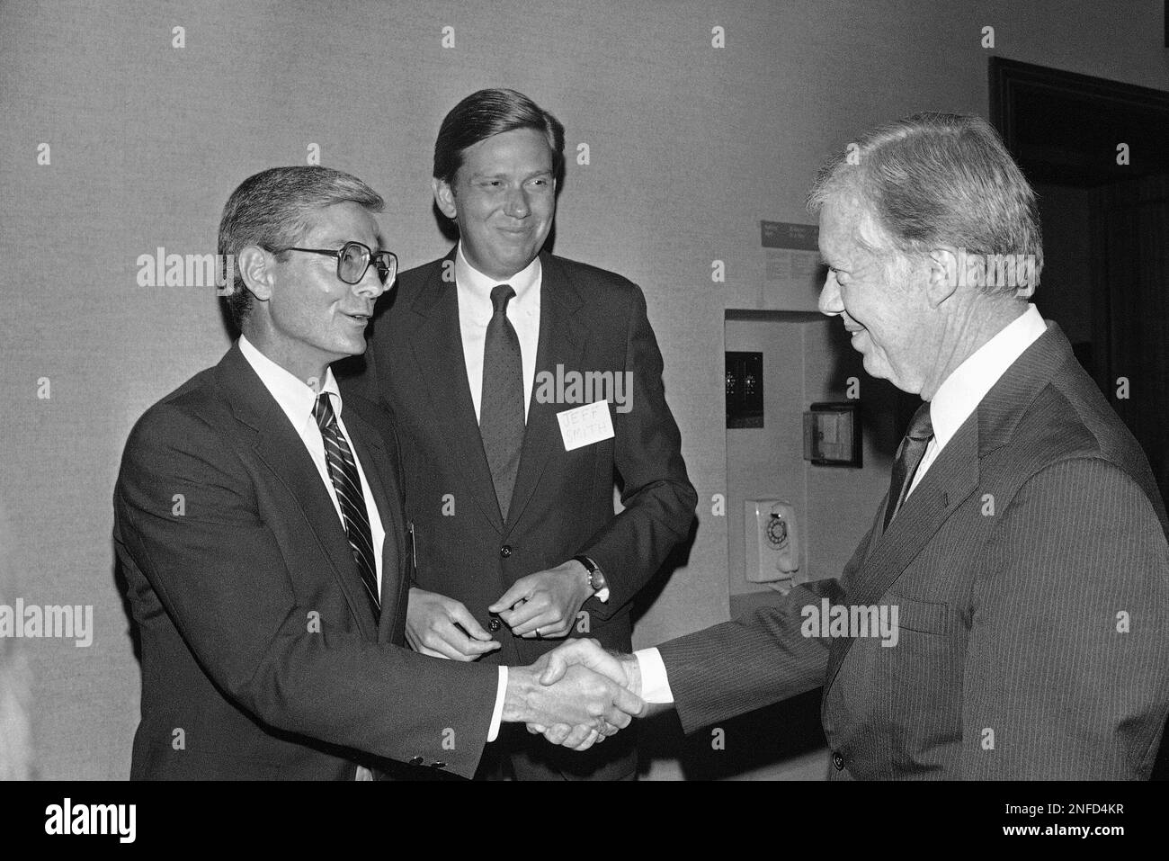 Former U.S. President Jimmy Carter, right, shakes hands with Richard ...