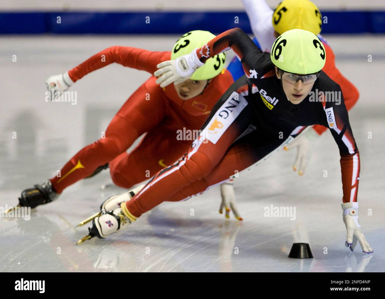 Canada's Marie-Andree Mendes-Campeau, right, skates with Hui Zhang, of ...