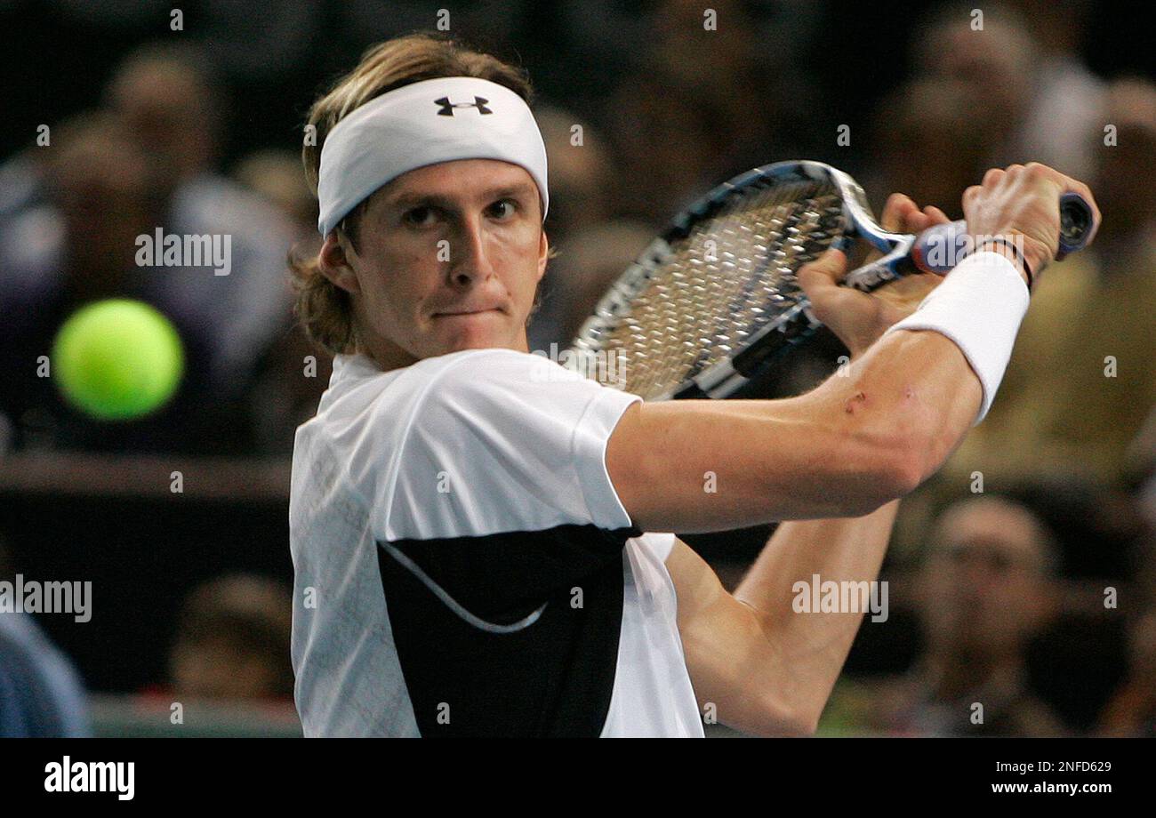 Igor Andreev of Russia plays a return to Paul Henri Mathieu of France ...