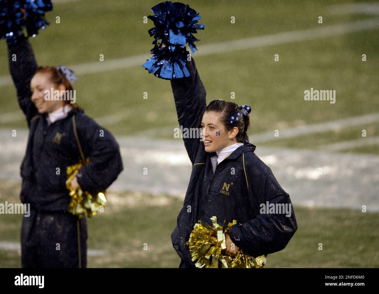 Navy cheerleaders are shown on the sidelines during the second half of ...