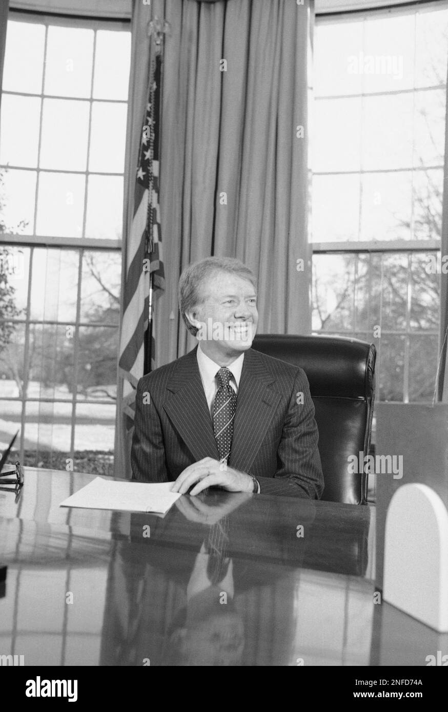 President Jimmy Carter beams as he sits in the White House Oval Office ...