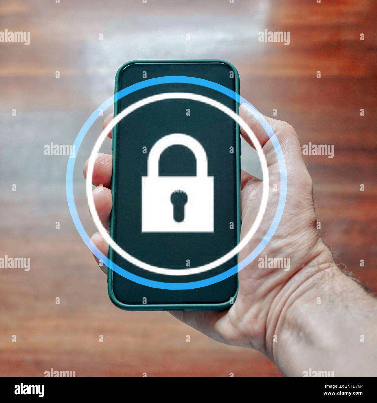 hand holding a phone with a padlock security symbol Stock Photo - Alamy