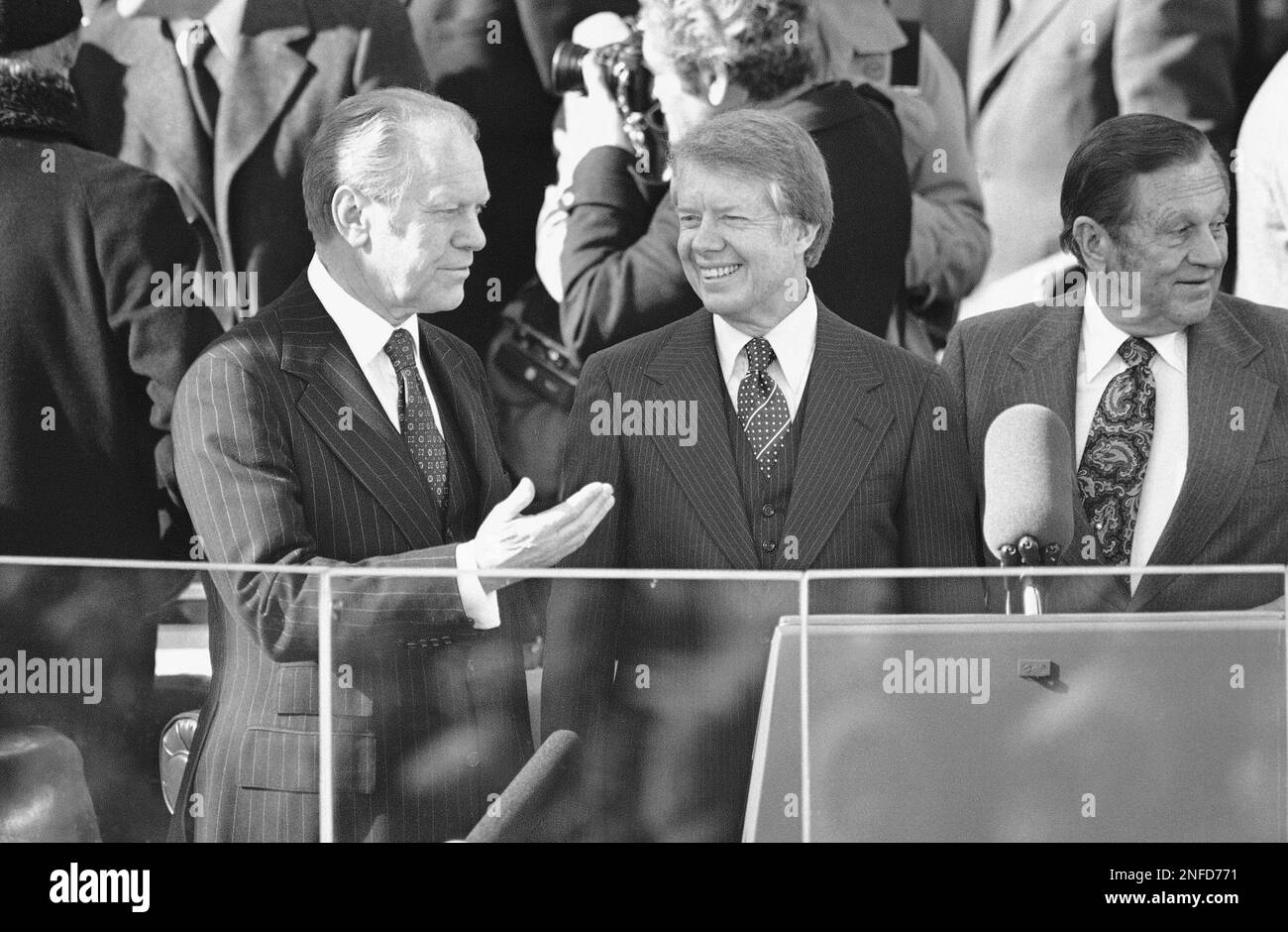 Outgoing President Gerald R. Ford extends his hand to President-elect ...