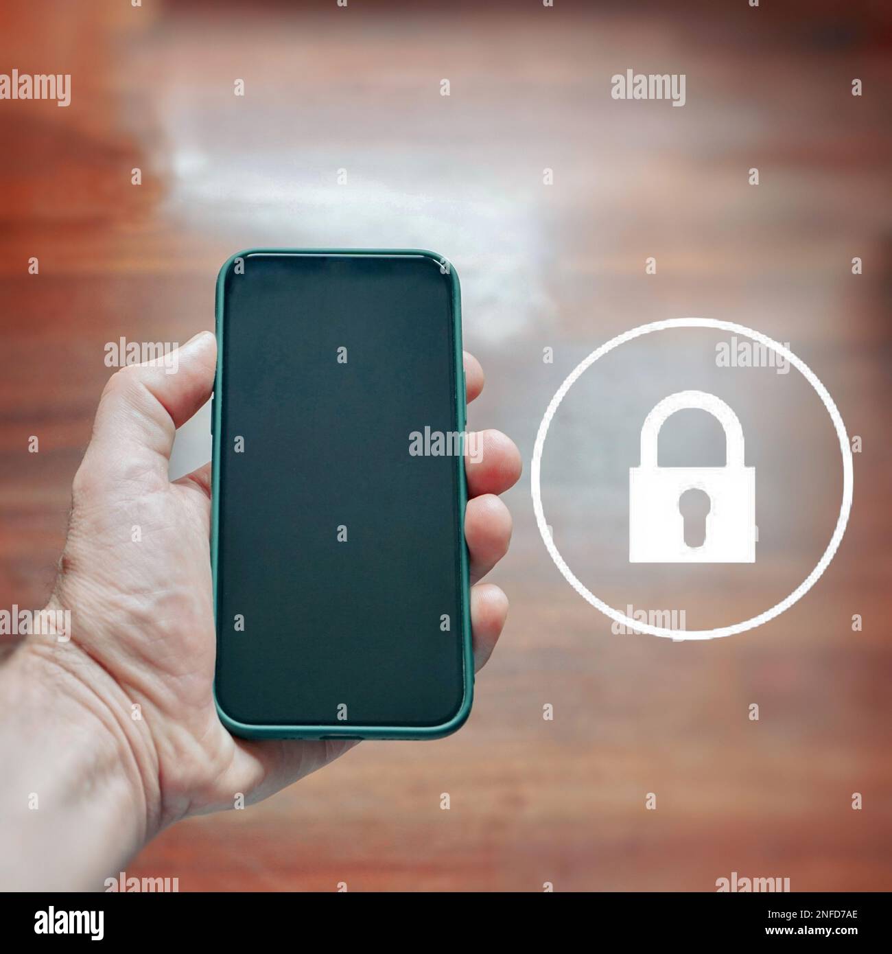 hand holding a phone with a padlock security symbol Stock Photo - Alamy
