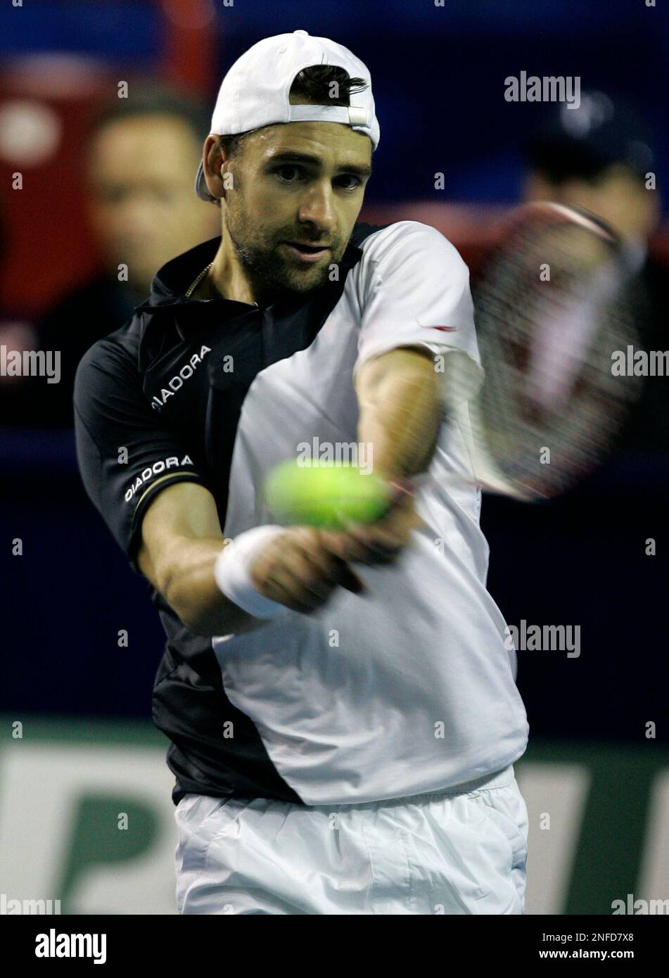 Nicolas Kiefer of Germany plays a return to Ivo Karlovic of Croatia ...