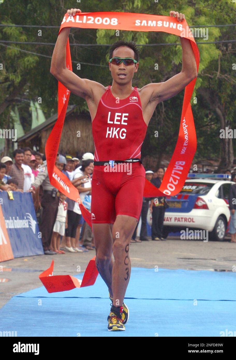 Hong Kong's Daniel Lee crosses the finish line to win the gold medal in ...