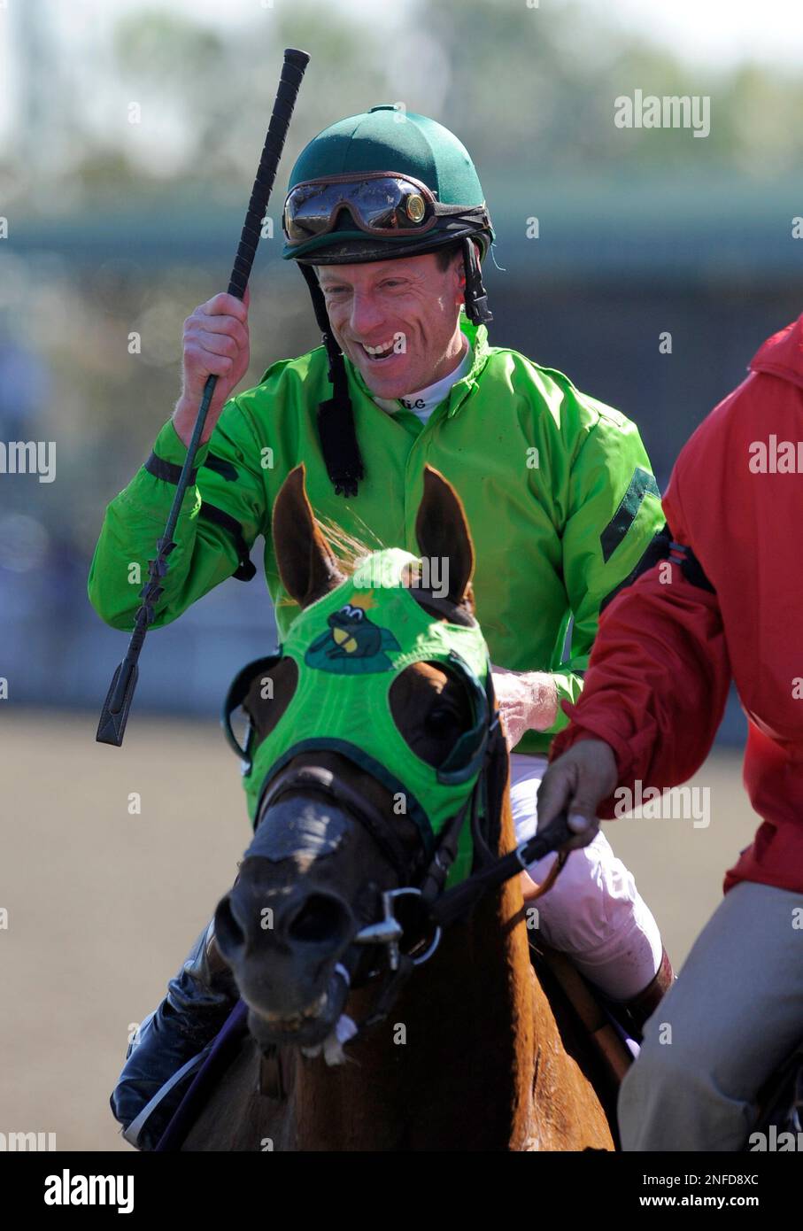 Jockey Richard Migliore aboard Desert Code celebrates after winning the ...