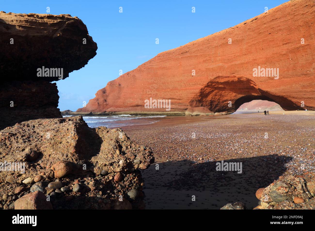 Morocco nature. Natural sedimentary rock arch and sandy beach in ...