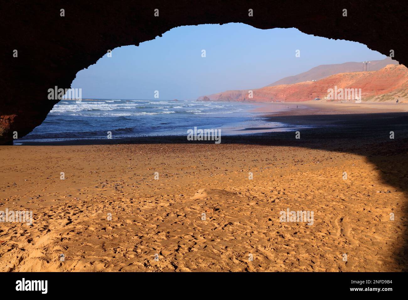 Morocco nature. Natural sedimentary rock arch and sandy beach in ...