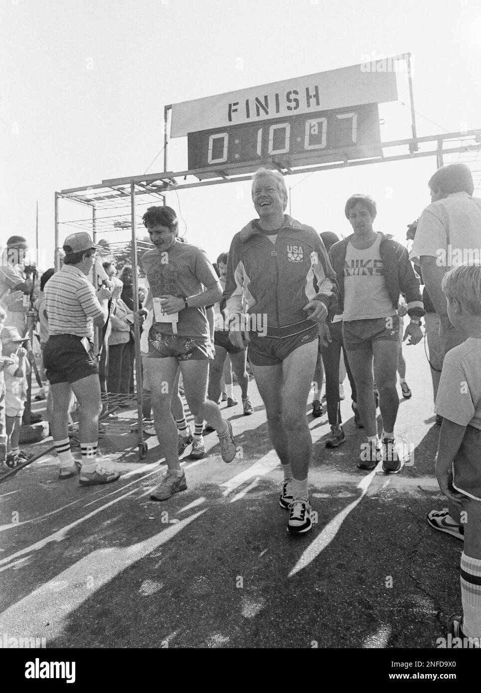 Former President Jimmy Carter passes the finish line in Plains, Ga ...