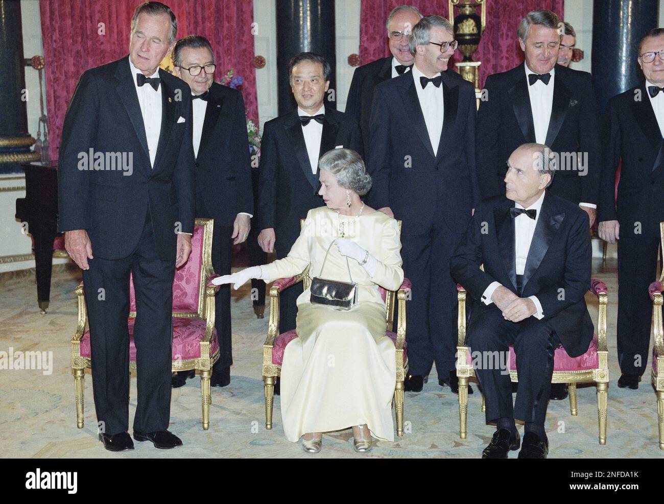 Queen Elizabeth II directs G-7 leaders for the photo session at Buckingham Palace in London ...